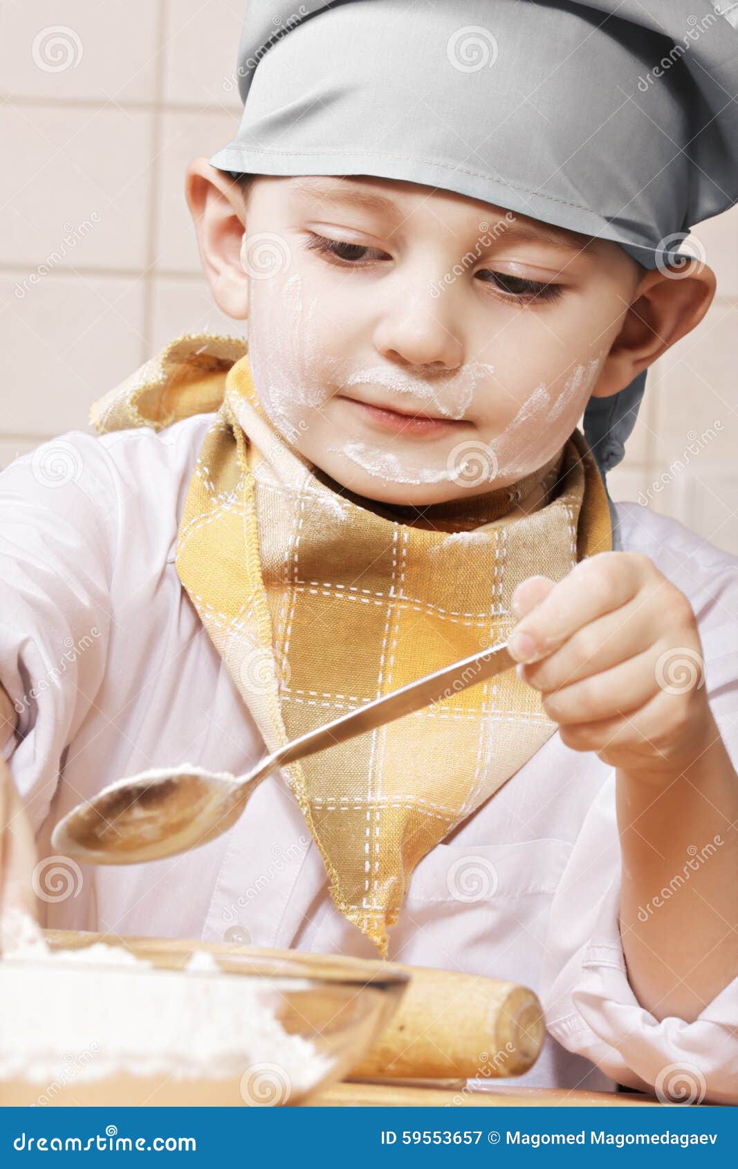 Boy cooking at the kitchen stock image. Image of neckerchief - 59553657