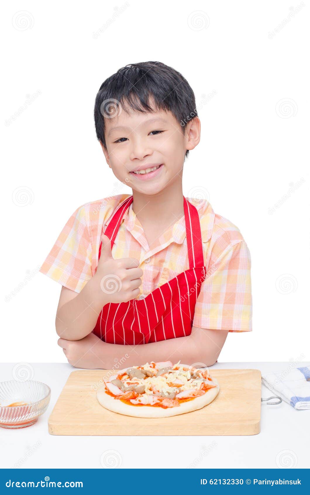 Boy cooking pizza on table stock photo. Image of cute - 62132330