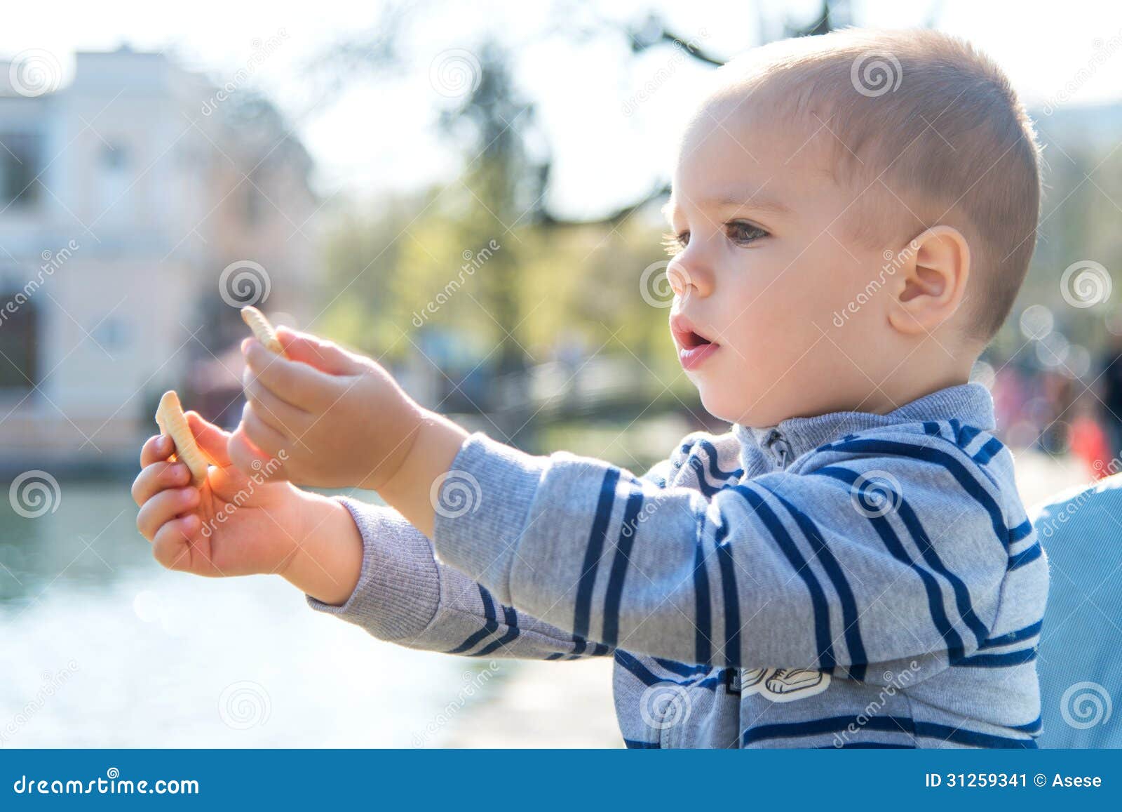 Boy with crackers stock image. Image of infant, cute - 31259341