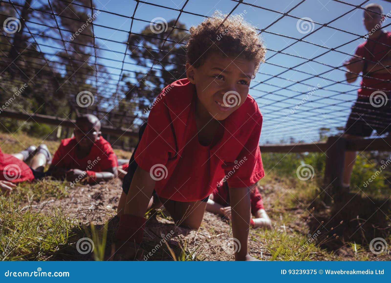 Boy Crawling Under the Net during Obstacle Course Training Stock Image ...