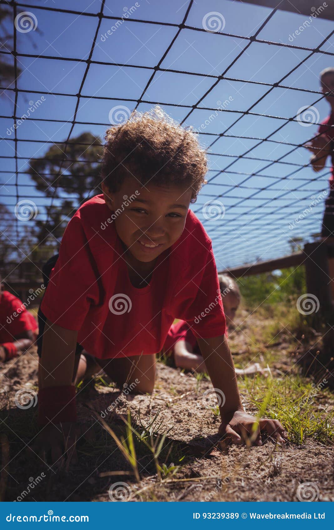 Boy Crawling Under the Net during Obstacle Course Training Stock Image ...