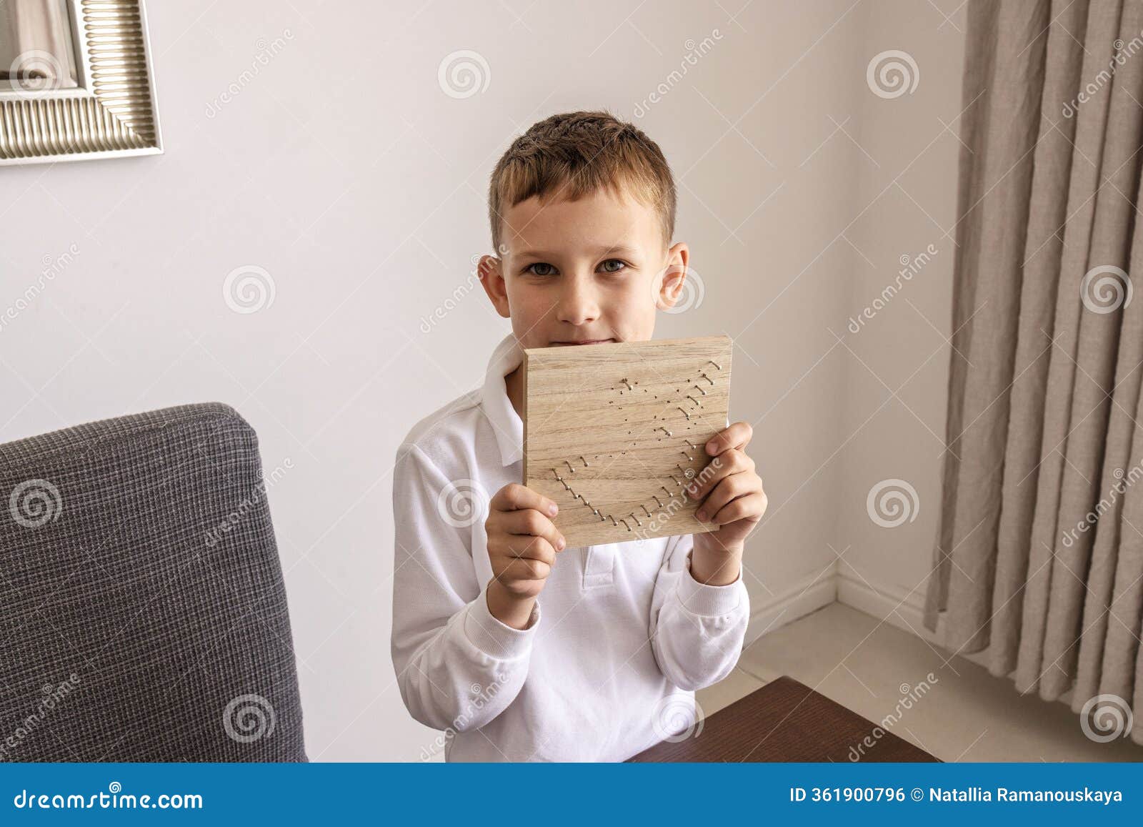 Boy Creating a Wooden Craft Project, Focused on Hands-on Activity ...