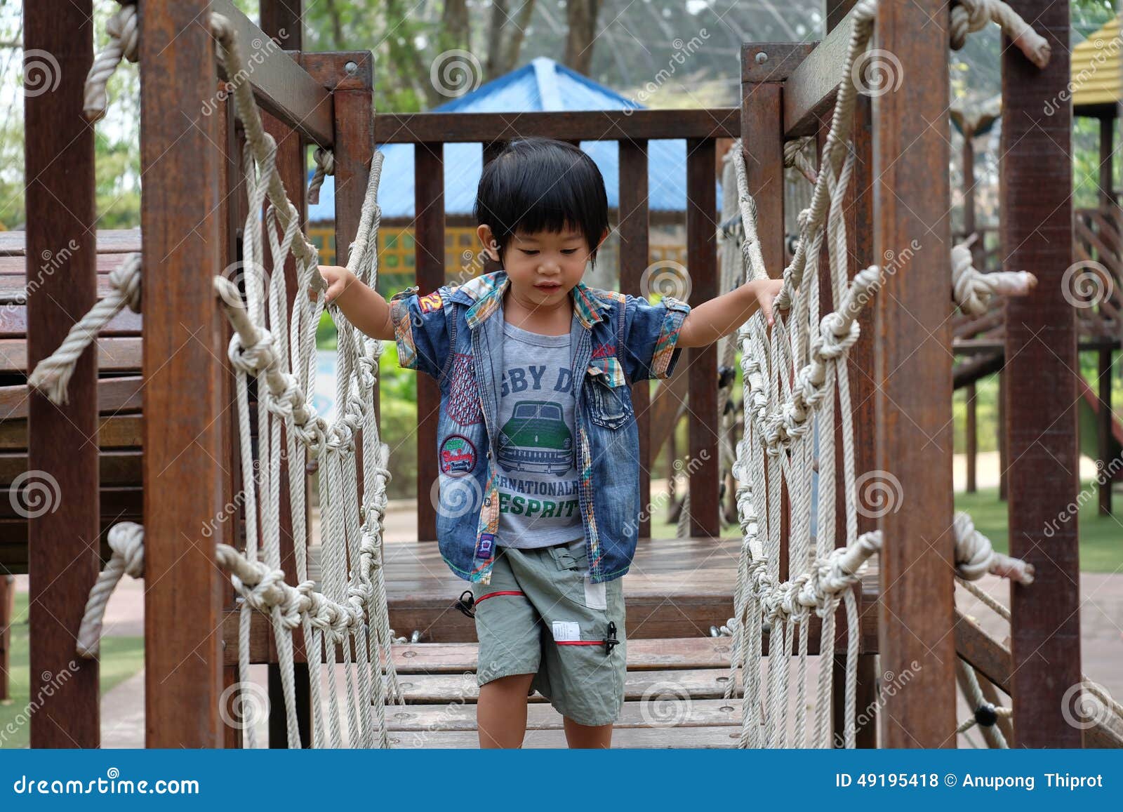 Boy is Crossing Rope Bridge in Play Ground Stock Photo - Image of laugh ...