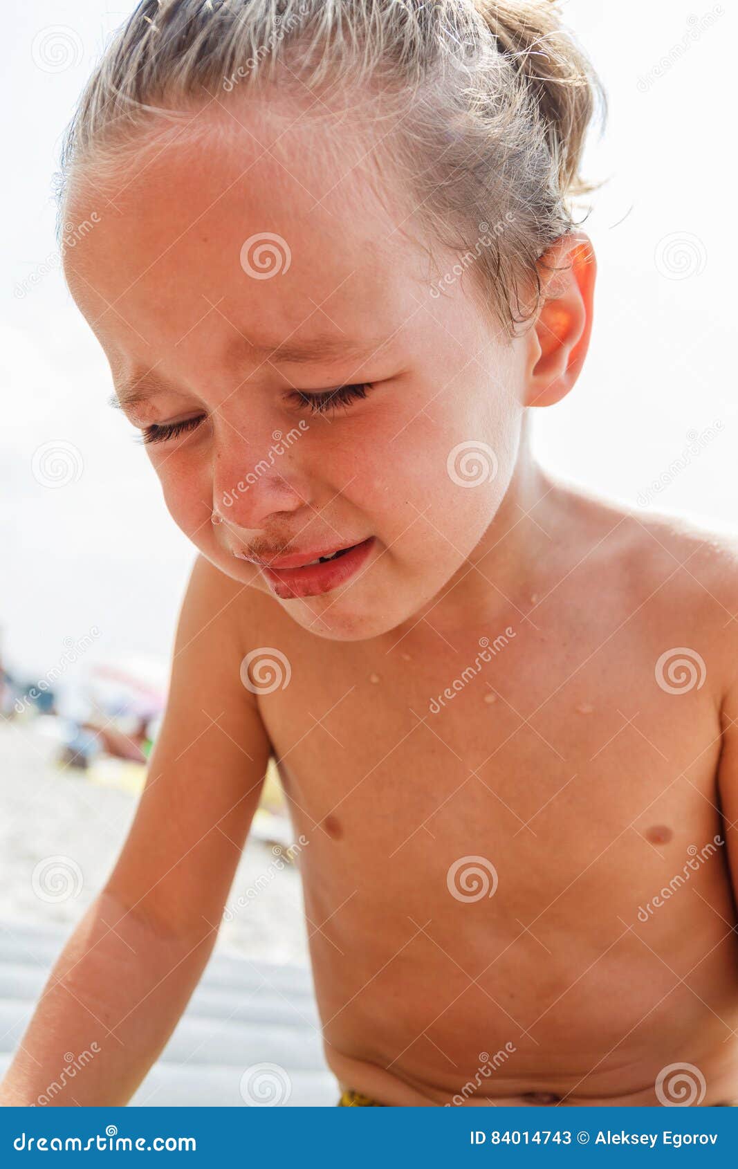 Boy crying on the beach stock image. Image of blond, alone - 84014743