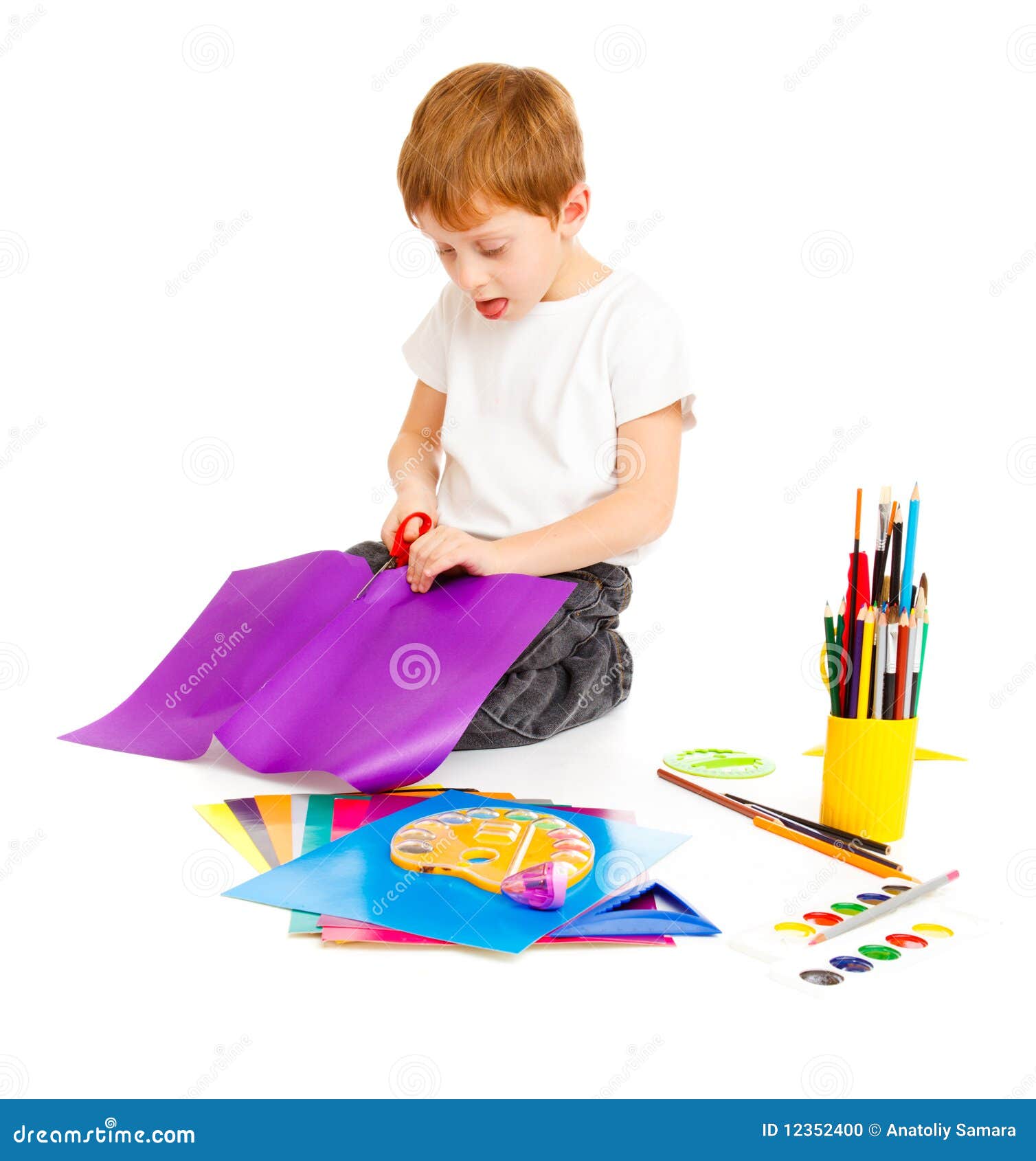 Boy cutting paper stock photo. Image of pretty, education - 12352400