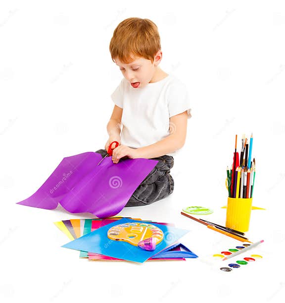 Boy cutting paper stock photo. Image of pretty, education - 12352400