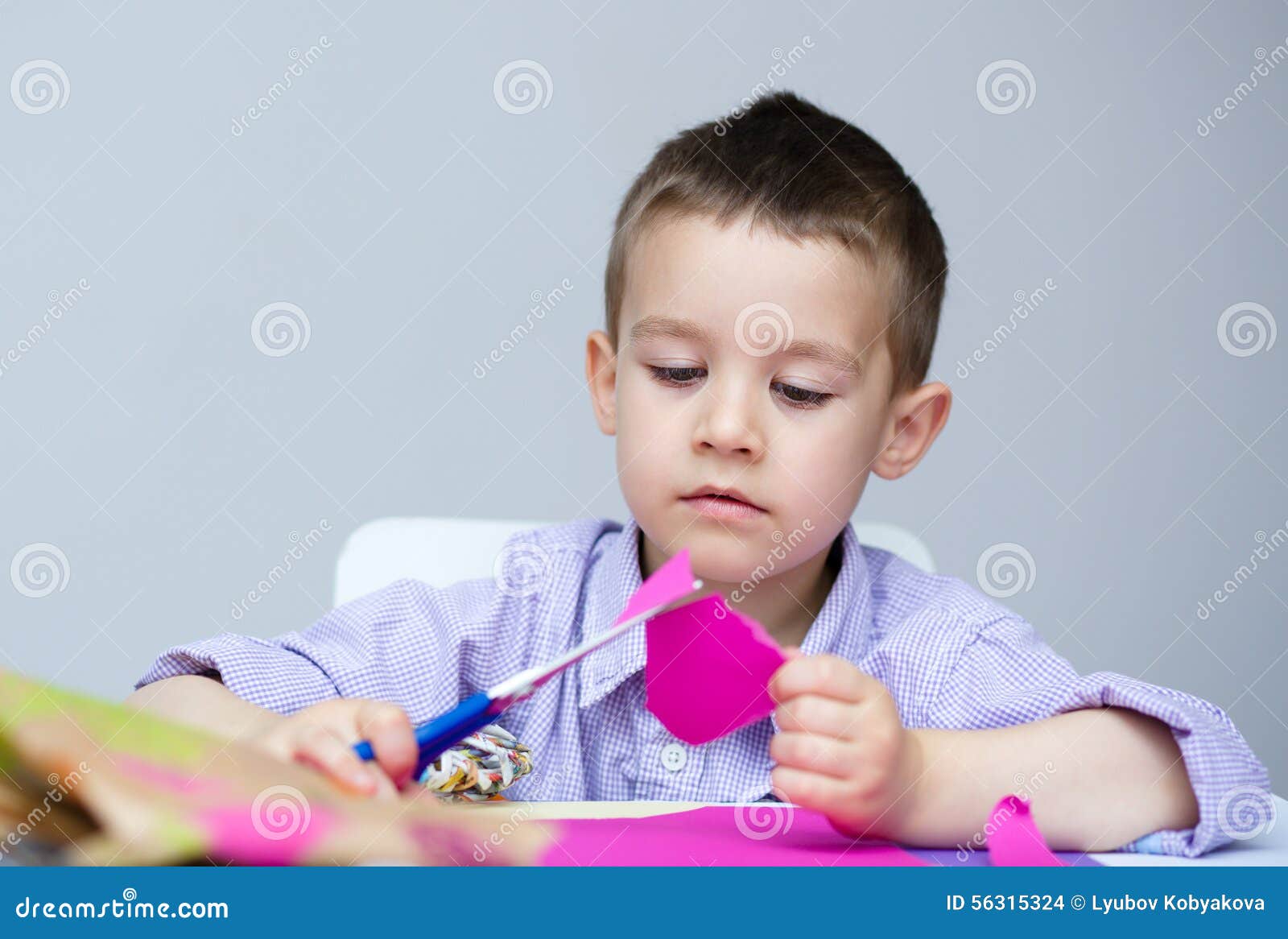 Boy is Cutting Paper Using Scissors Stock Photo - Image of party ...
