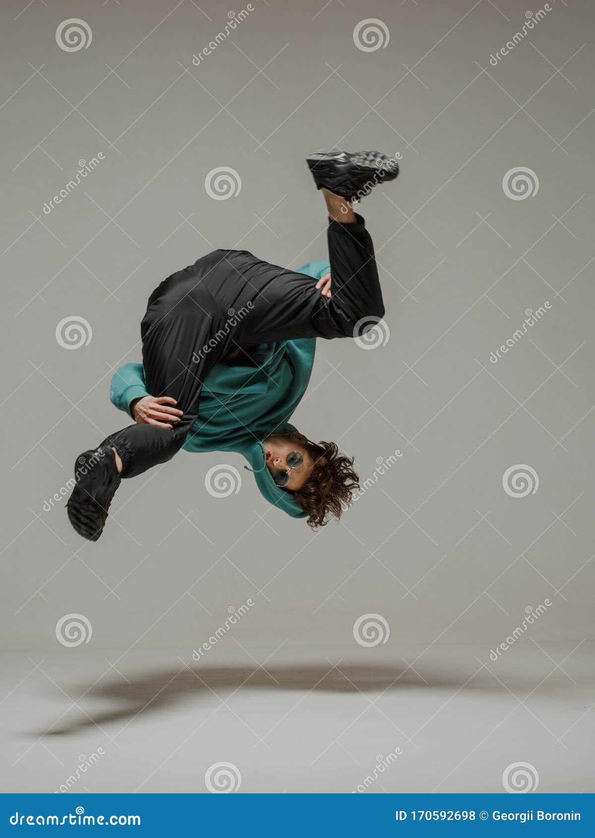 Boy Dancing Breakdance Mid-air in Studio. Acrobatic Dancer. Stock Photo ...