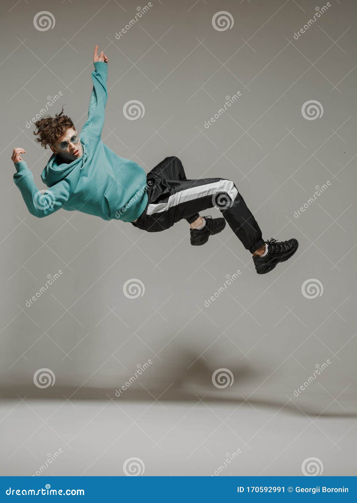 Boy Dancing Breakdance Mid-air in Studio. Acrobatic Dancer. Stock Image ...
