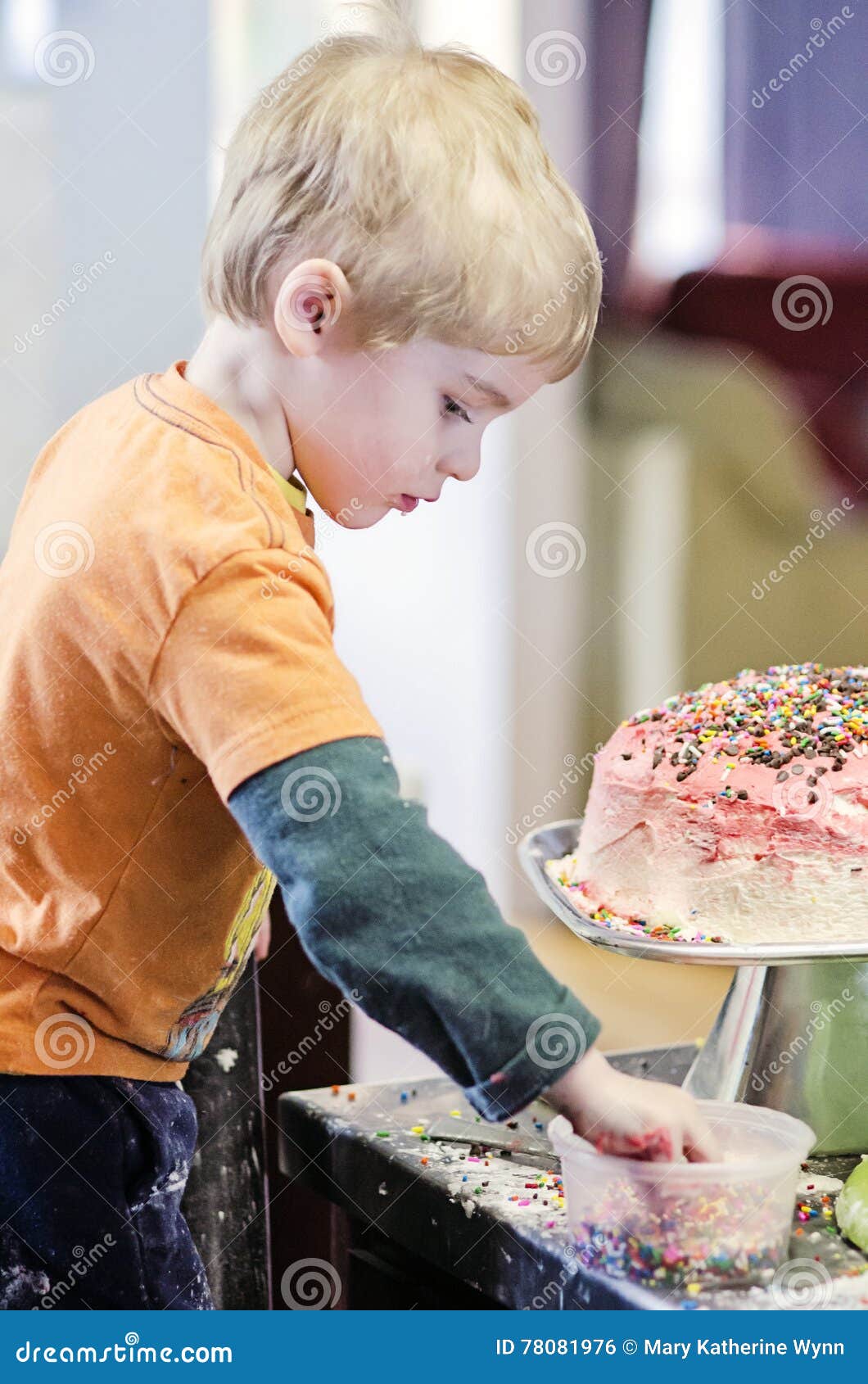 Boy decorating cake stock photo. Image of decorating - 78081976