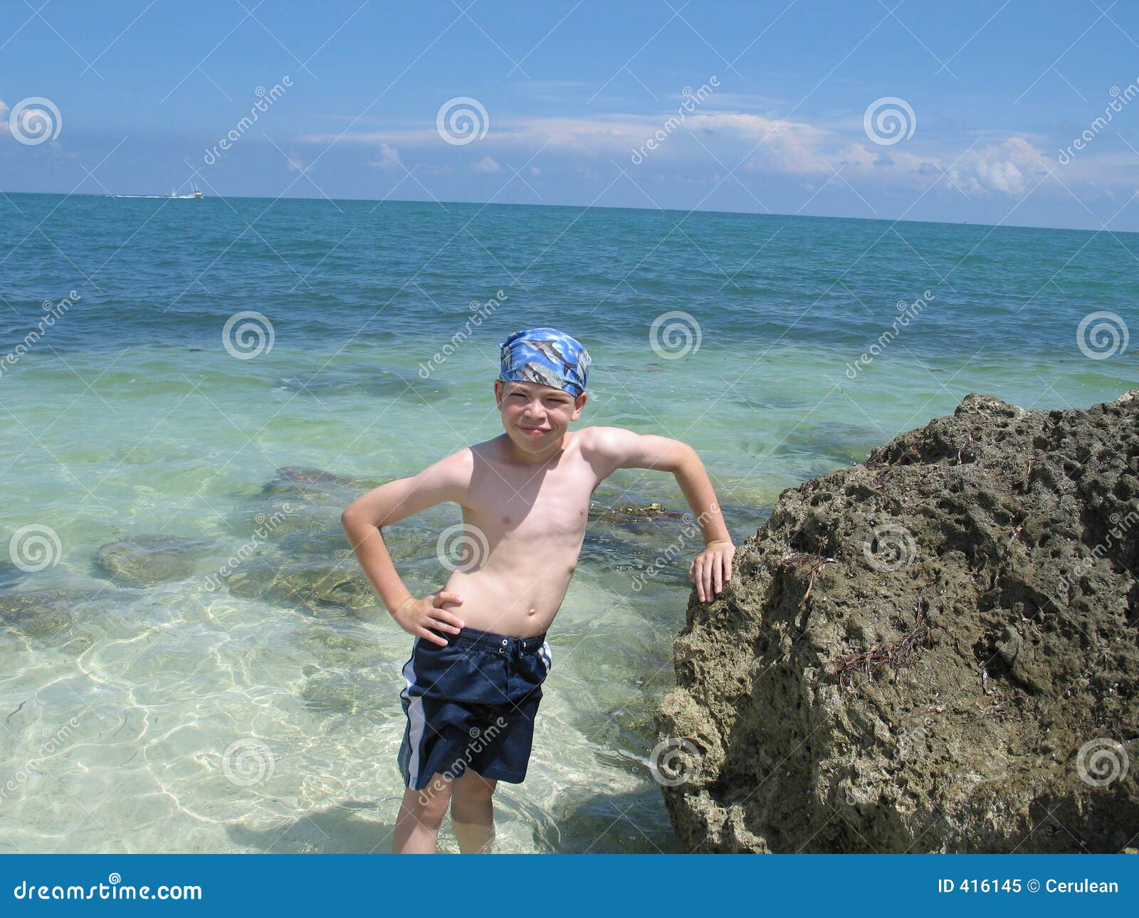 Boy by the deep green sea stock image. Image of american - 416145