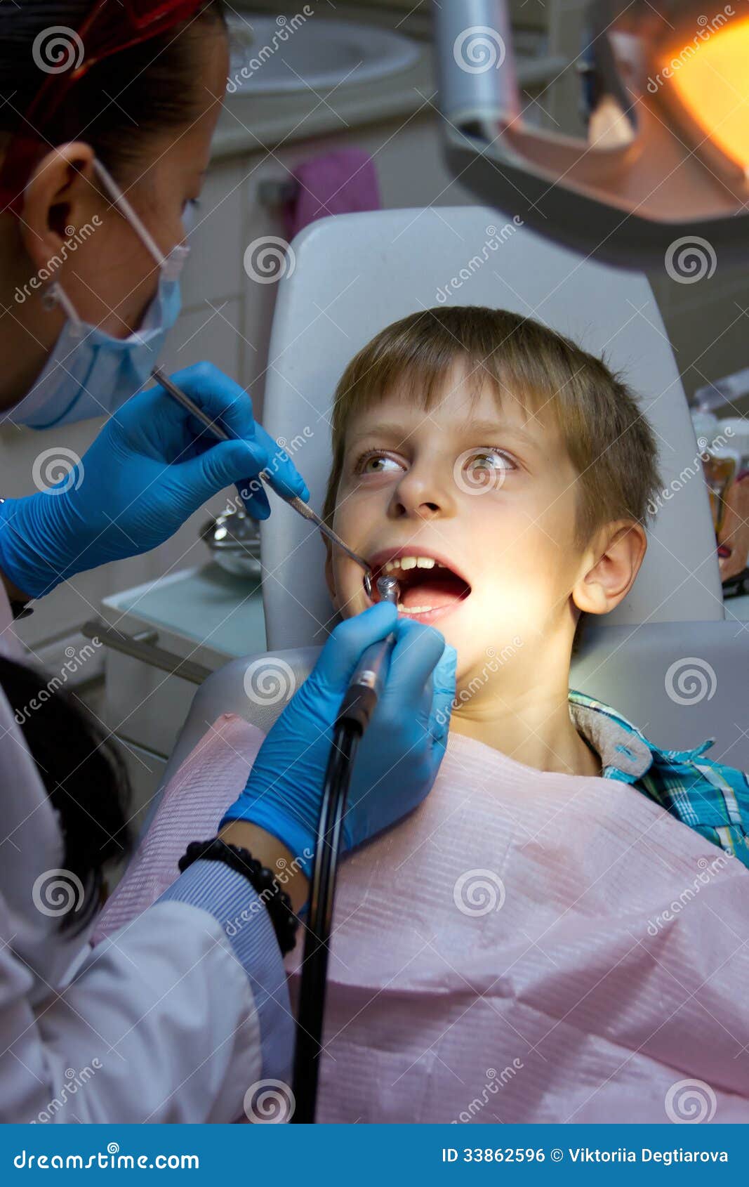 Boy in a dental surgery stock photo. Image of assistant - 33862596