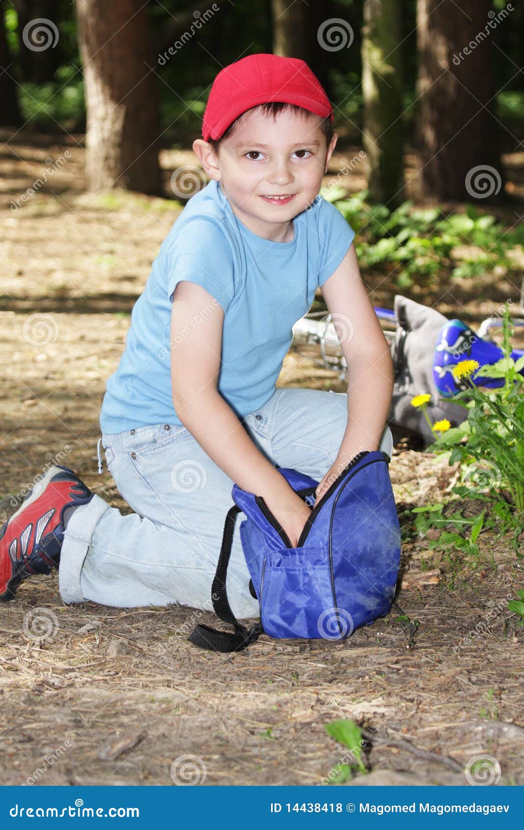 Boy digging in bag stock photo. Image of casual, digging - 14438418