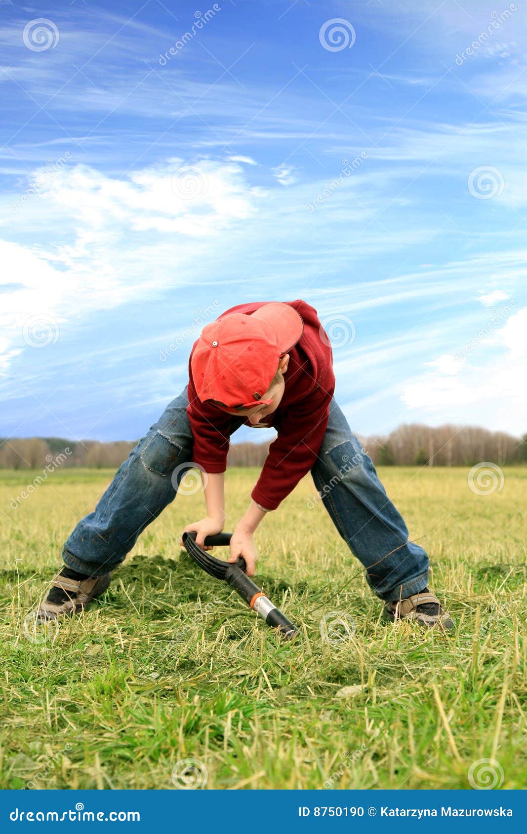 Boy digging on the meadow. stock photo. Image of grass - 8750190