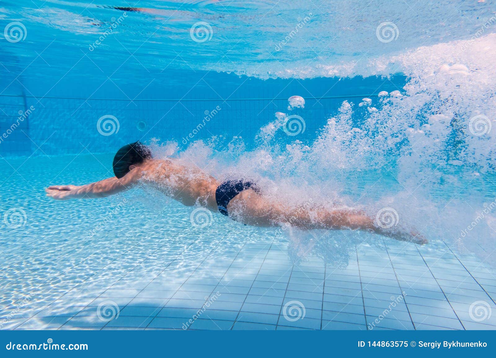 Boy dive in swimming pool stock image. Image of swim - 144863575