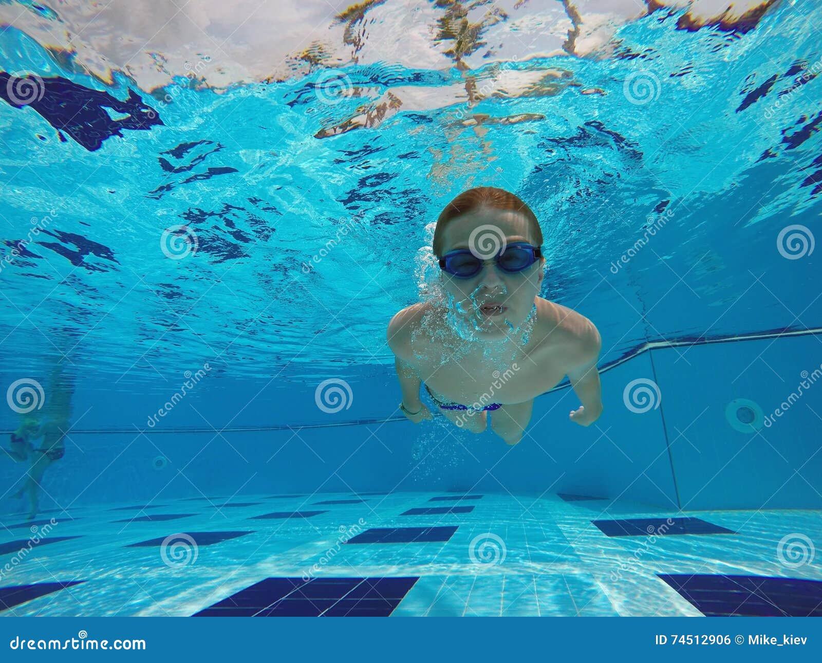 Boy Diving into a Swimming Pool Stock Photo - Image of young, bubbles ...