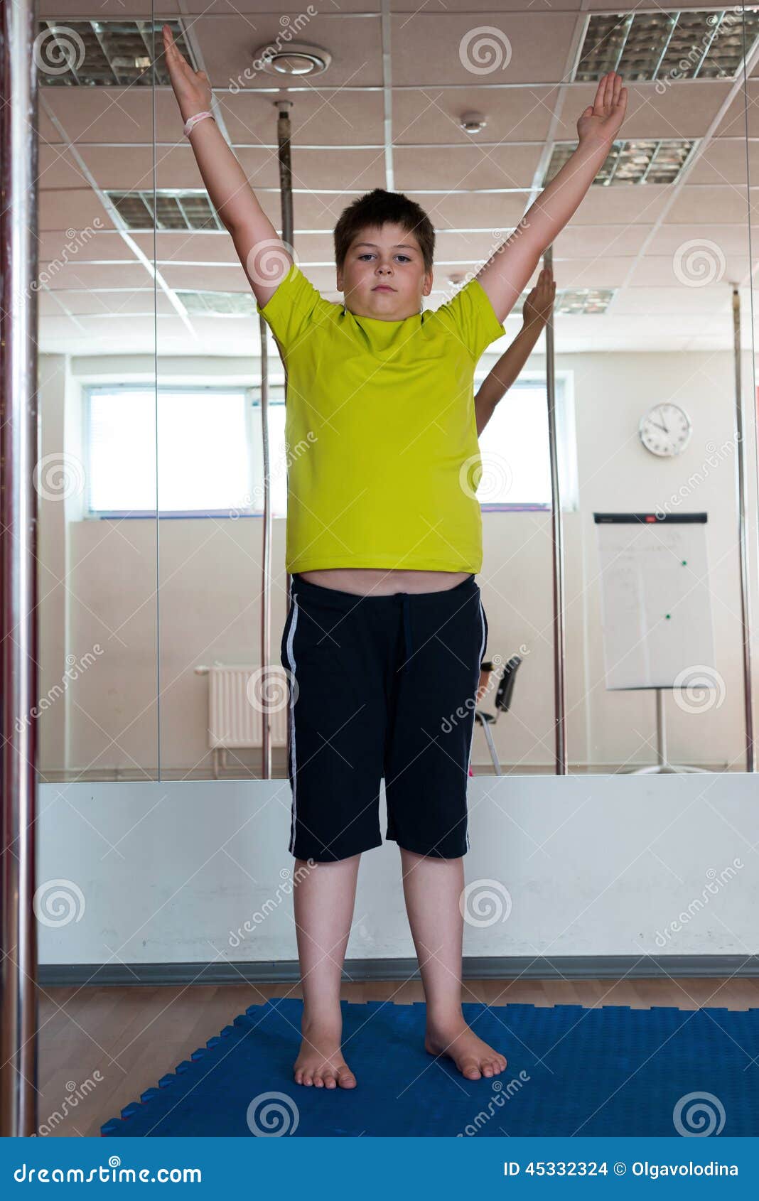 Boy Does Exercise in the Gym Stock Photo - Image of cheerful, fitness ...