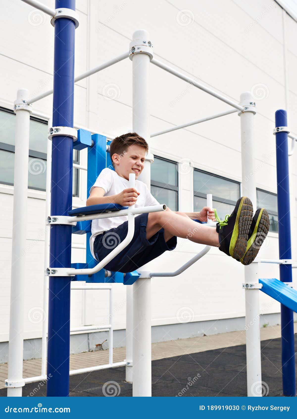 Boy Does Exercises on Sports Ground Stock Photo - Image of active ...