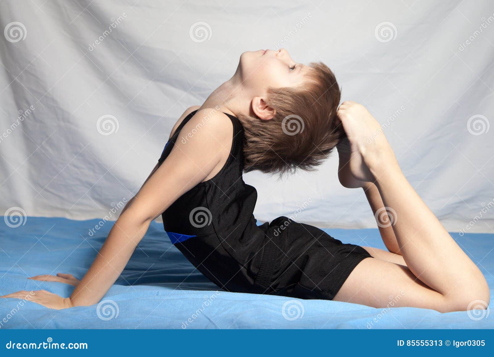 Boy does gymnastics stock image. Image of active, gymnast - 85555313
