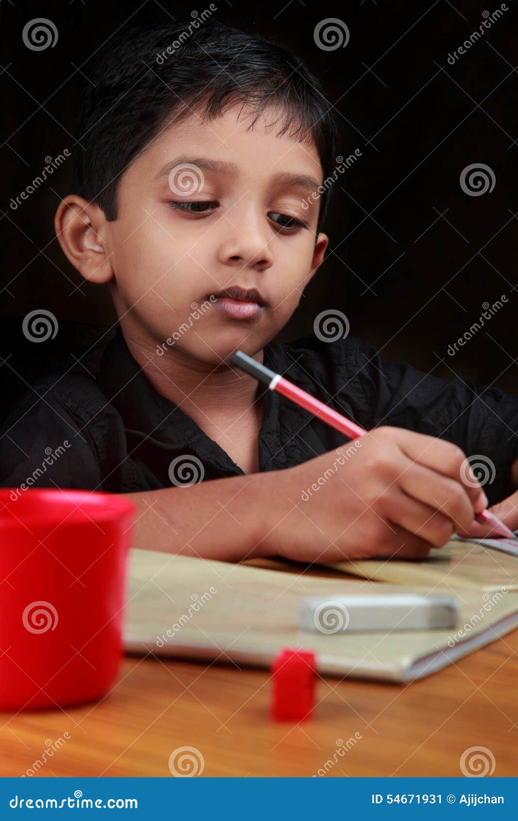 A boy does his homework stock image. Image of homework - 54671931