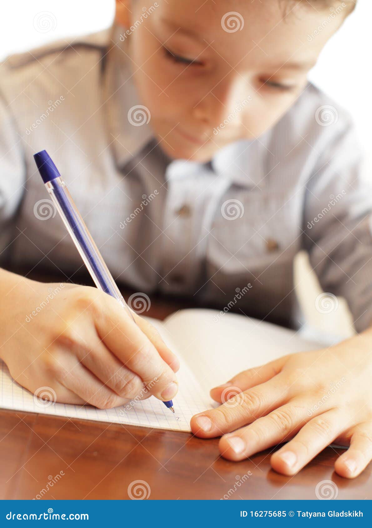 Boy does a lesson stock image. Image of book, indoors - 16275685