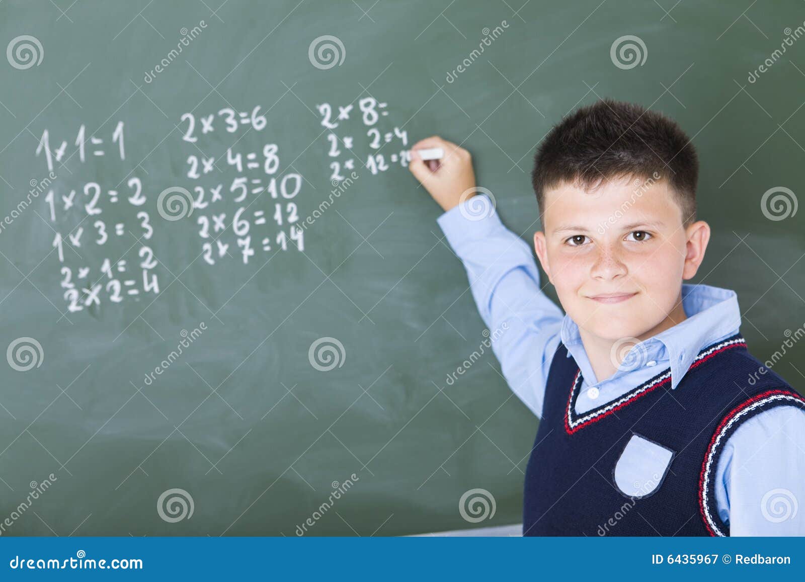 A Boy Does Multiplication on Chalkboard Stock Image - Image of ...