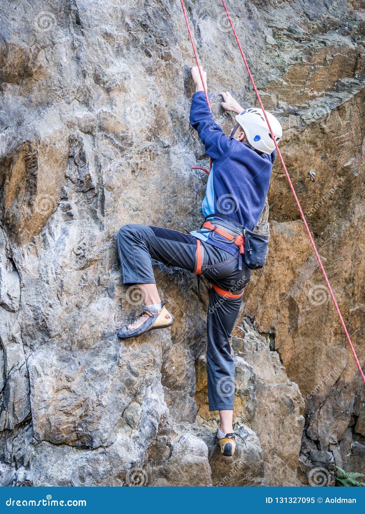 A boy does rock climbing editorial image. Image of climb - 131327095