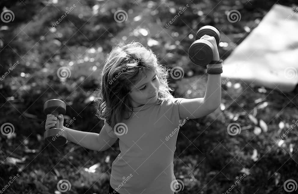 Boy is Doing Exercises To Develop Muscles. Child is Doing Exercises ...