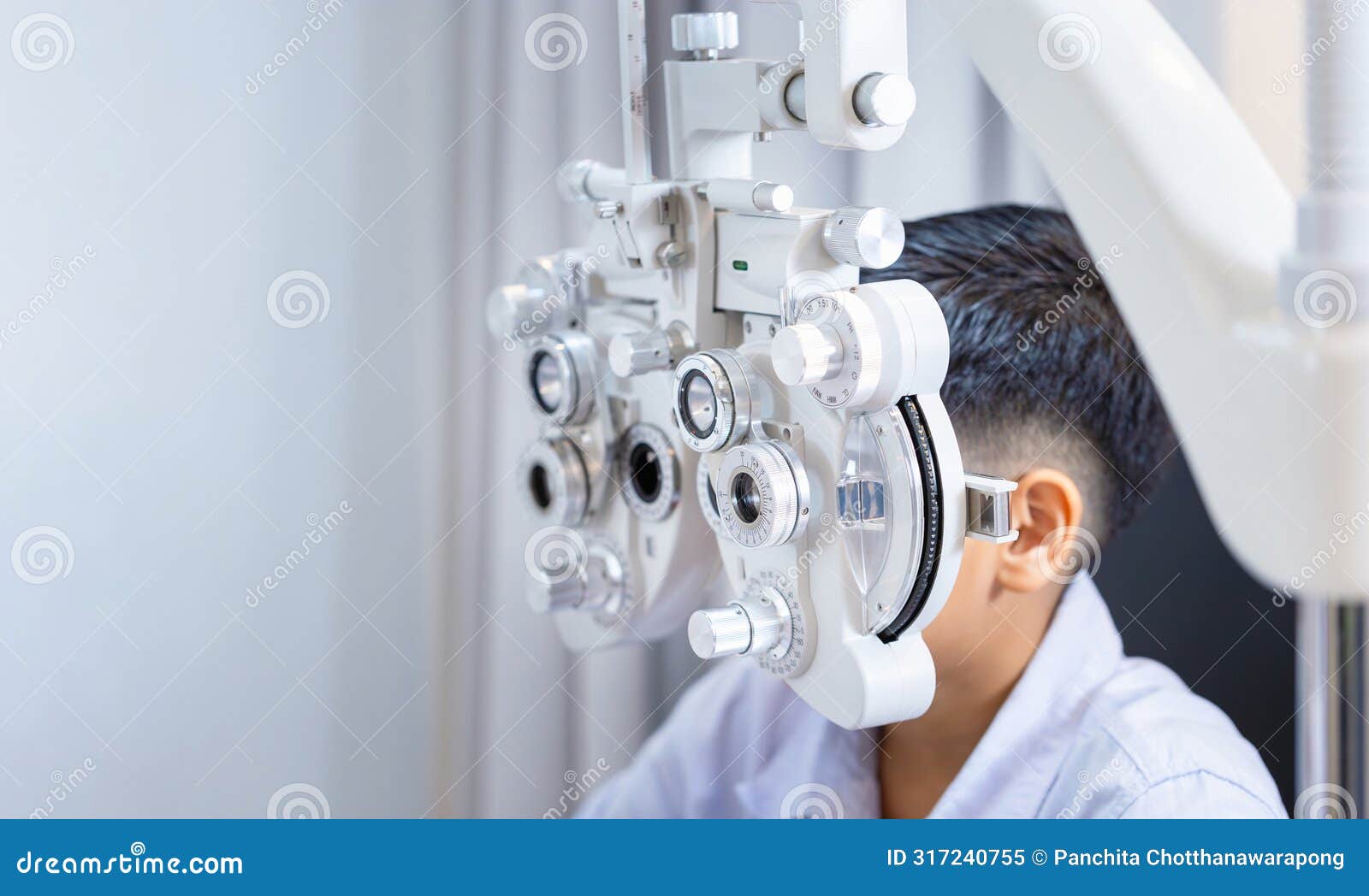 Boy Doing Eye Test Checking Examination with an Optometrist in the ...