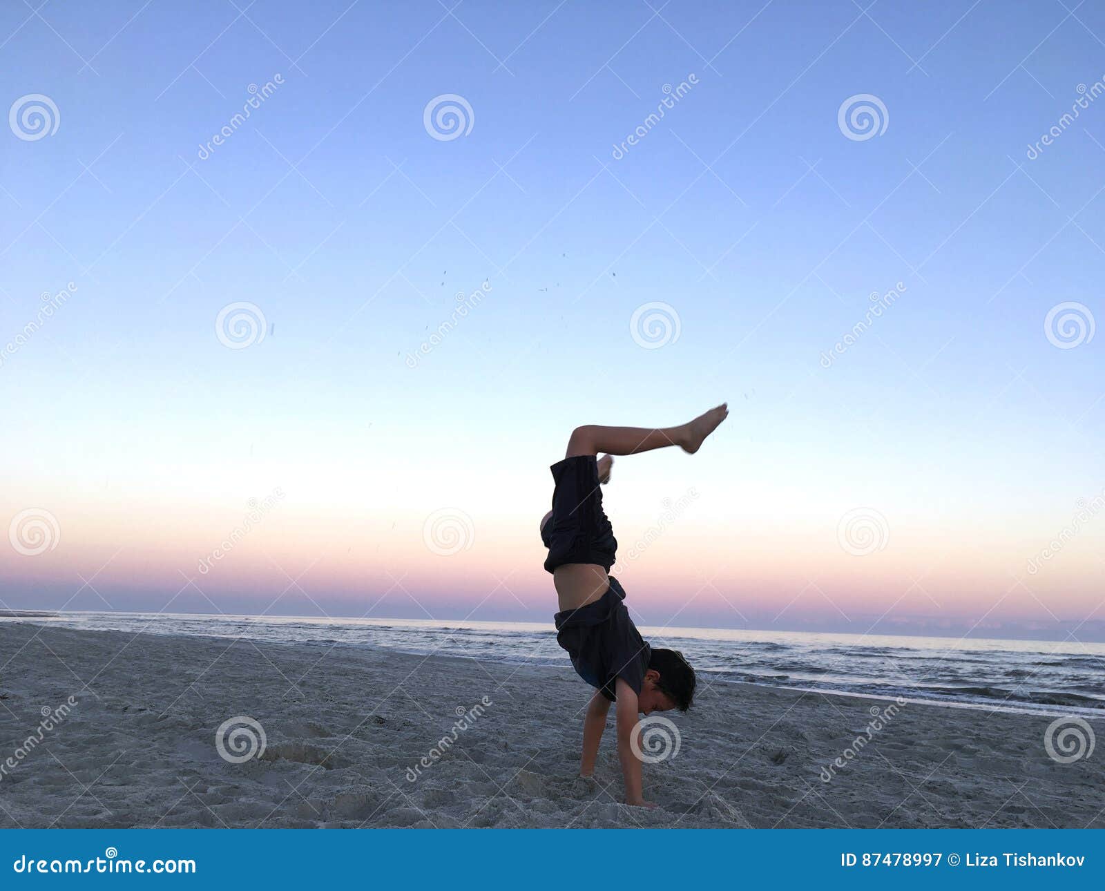 Boy Doing Handstand on Beach Stock Image - Image of handstand, outdoor ...