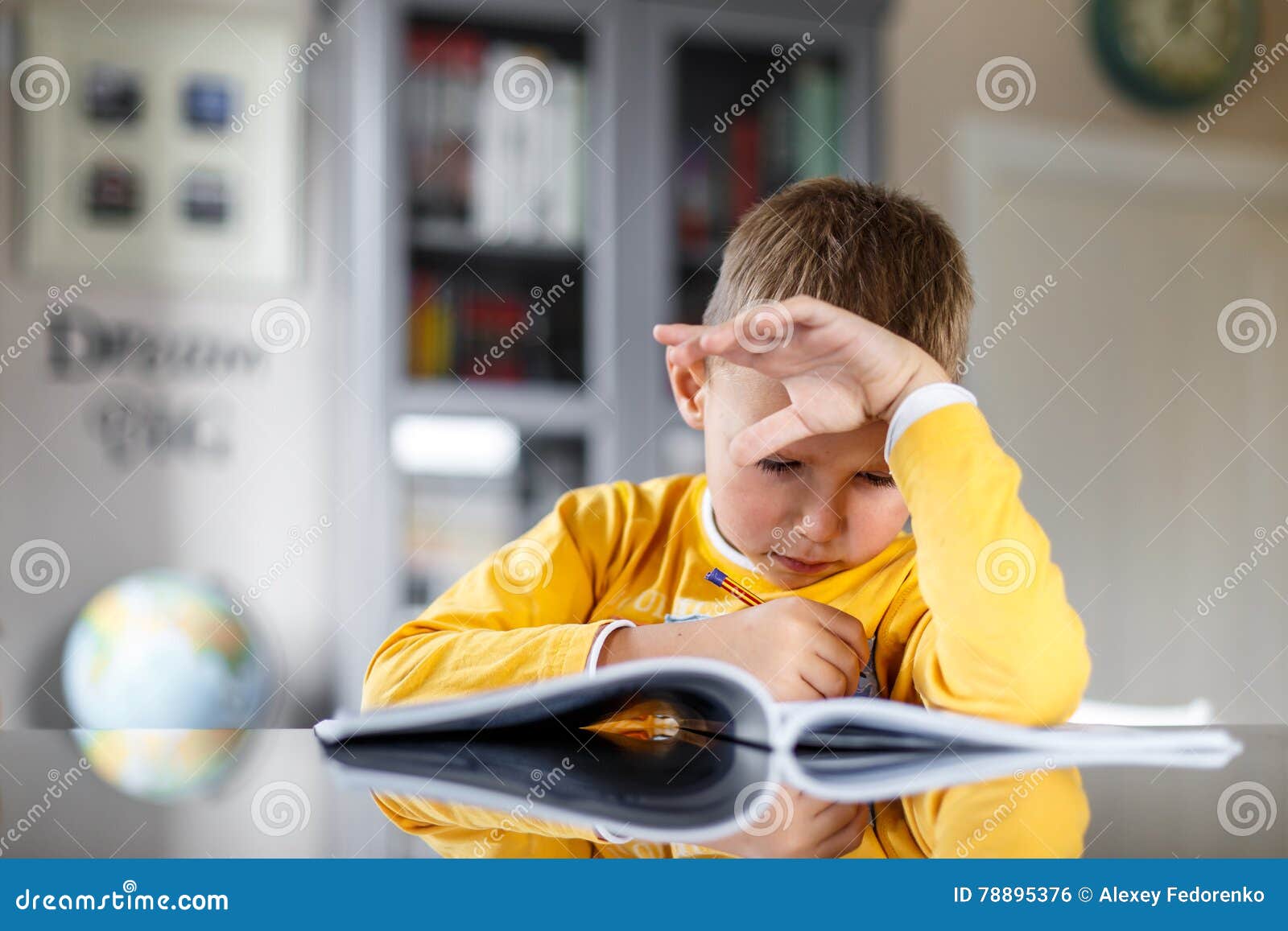 Boy doing his homework stock photo. Image of lesson, pencil - 78895376