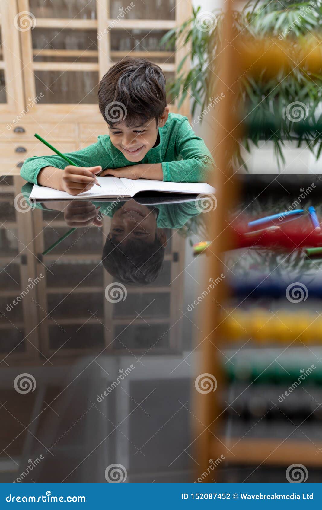 Boy Doing His Homework on a Table Stock Photo - Image of leisure ...