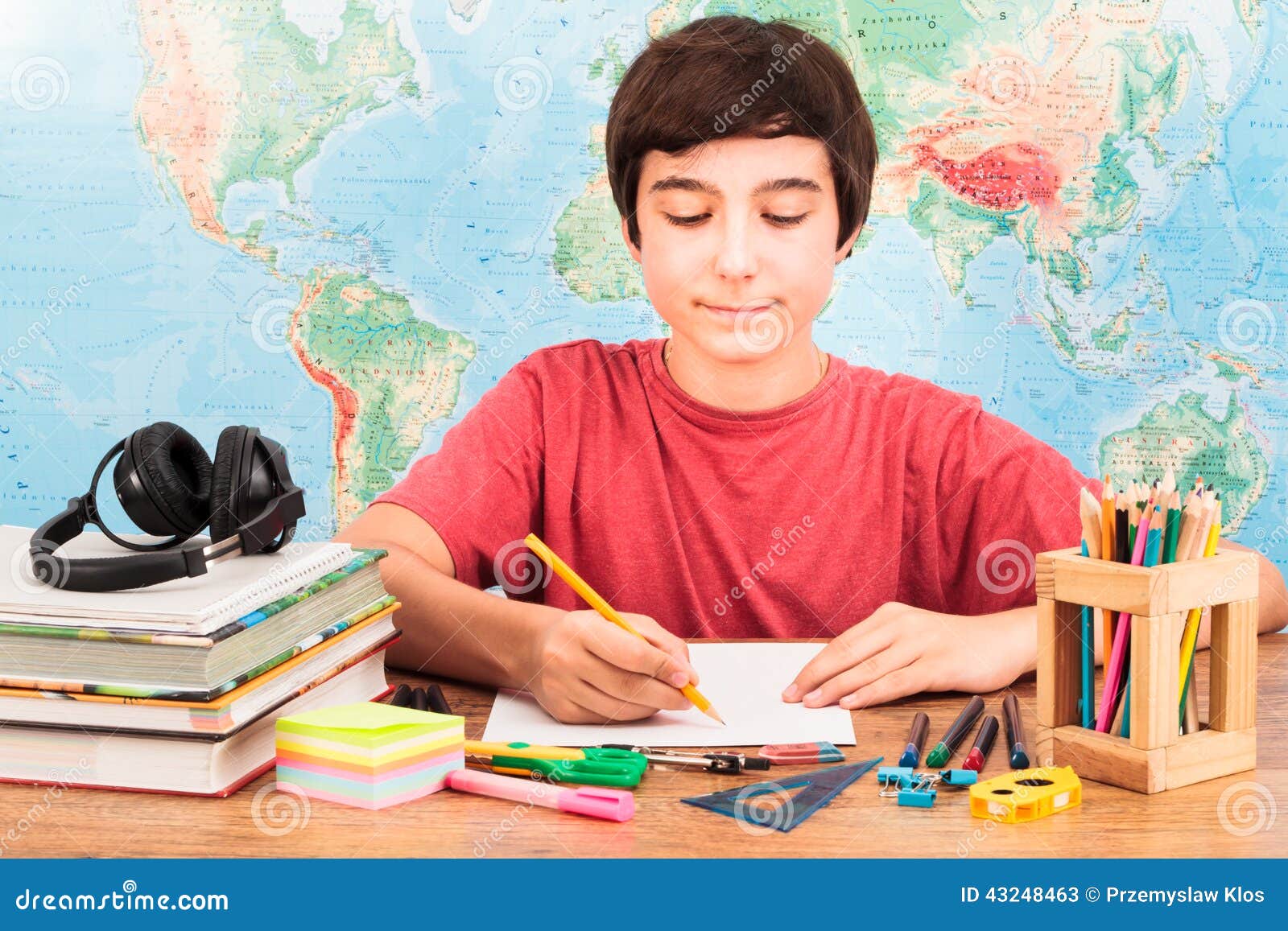 Boy doing his homework stock image. Image of desk, game - 43248463