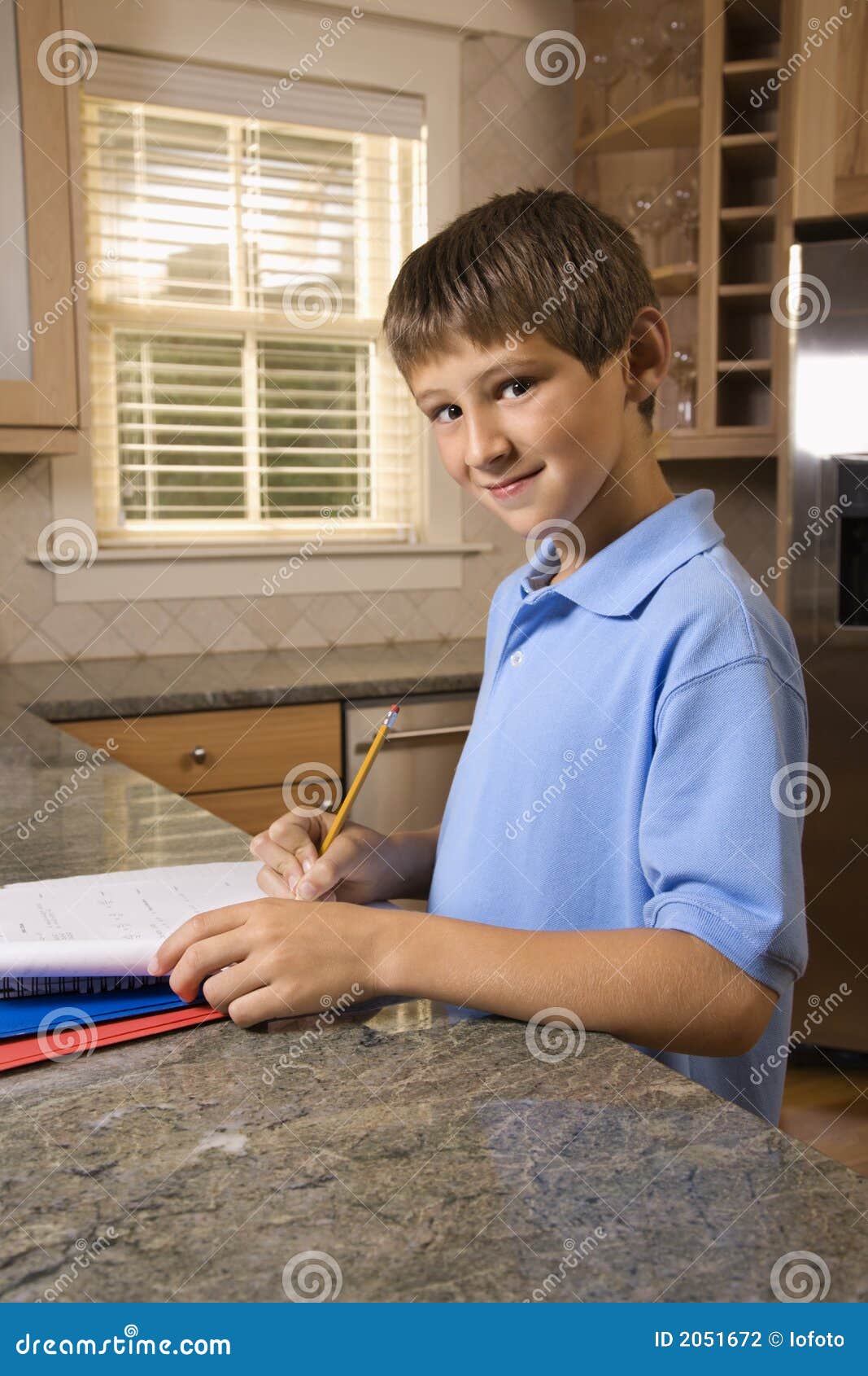 Boy doing homework stock photo. Image of everyday, counter - 2051672