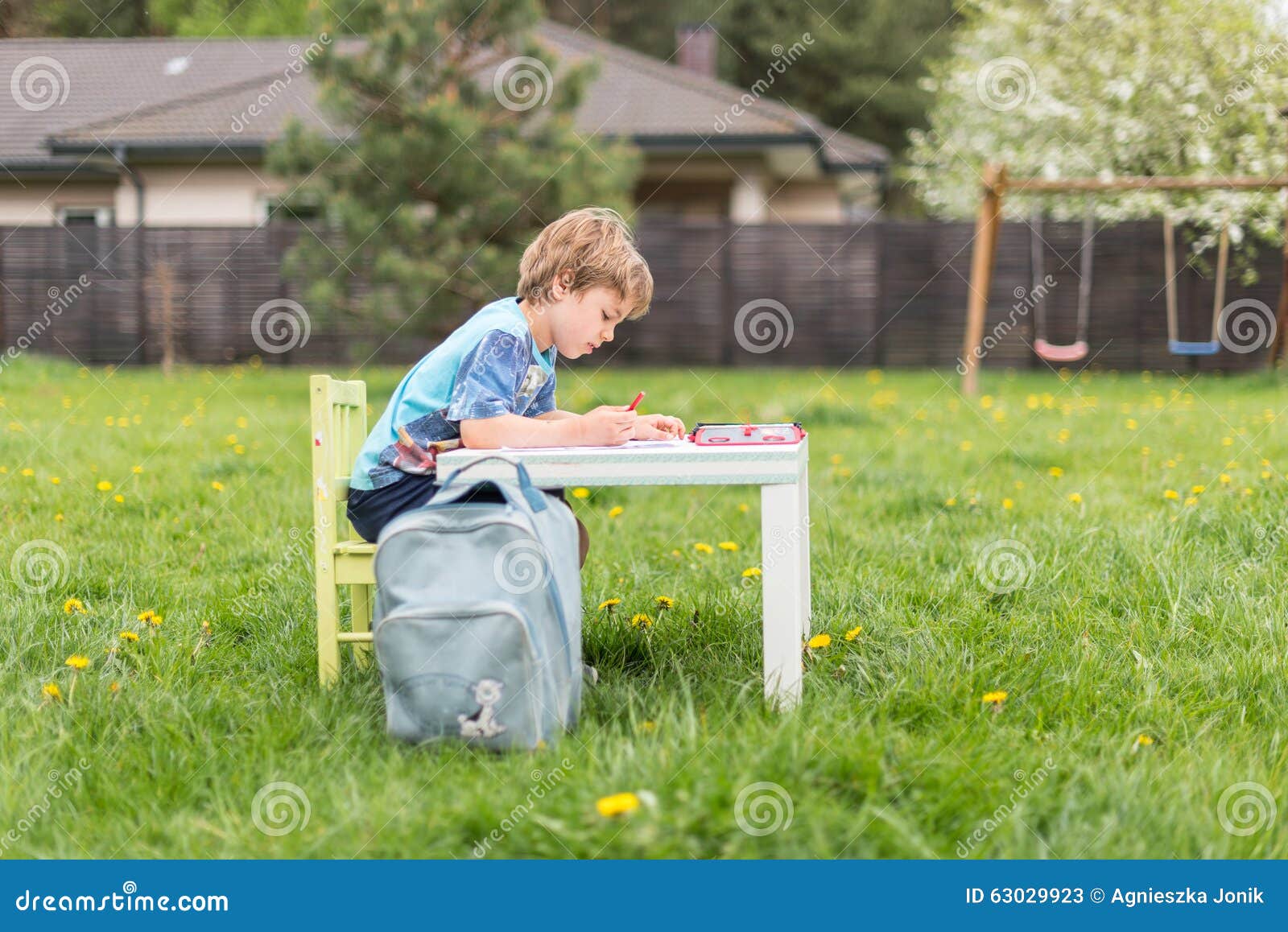 Boy Doing Homework in Backyard Stock Image - Image of caucasian ...