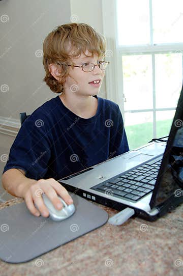 Boy Doing Homework on Computer Stock Photo - Image of smile, education ...