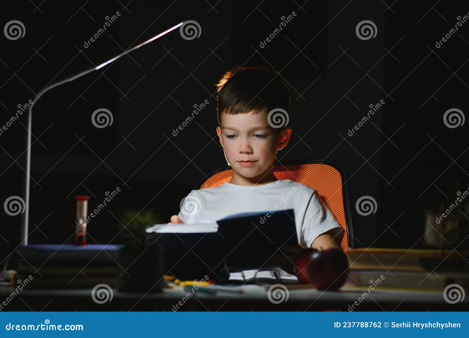Boy Doing Homework at Home in Evening Stock Photo - Image of study ...