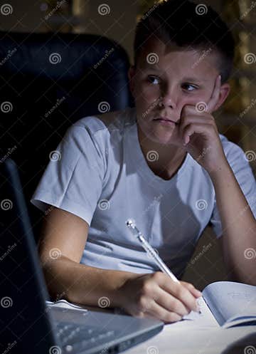 Boy Doing Homework with Laptop Stock Image - Image of lamp, tone: 6417327