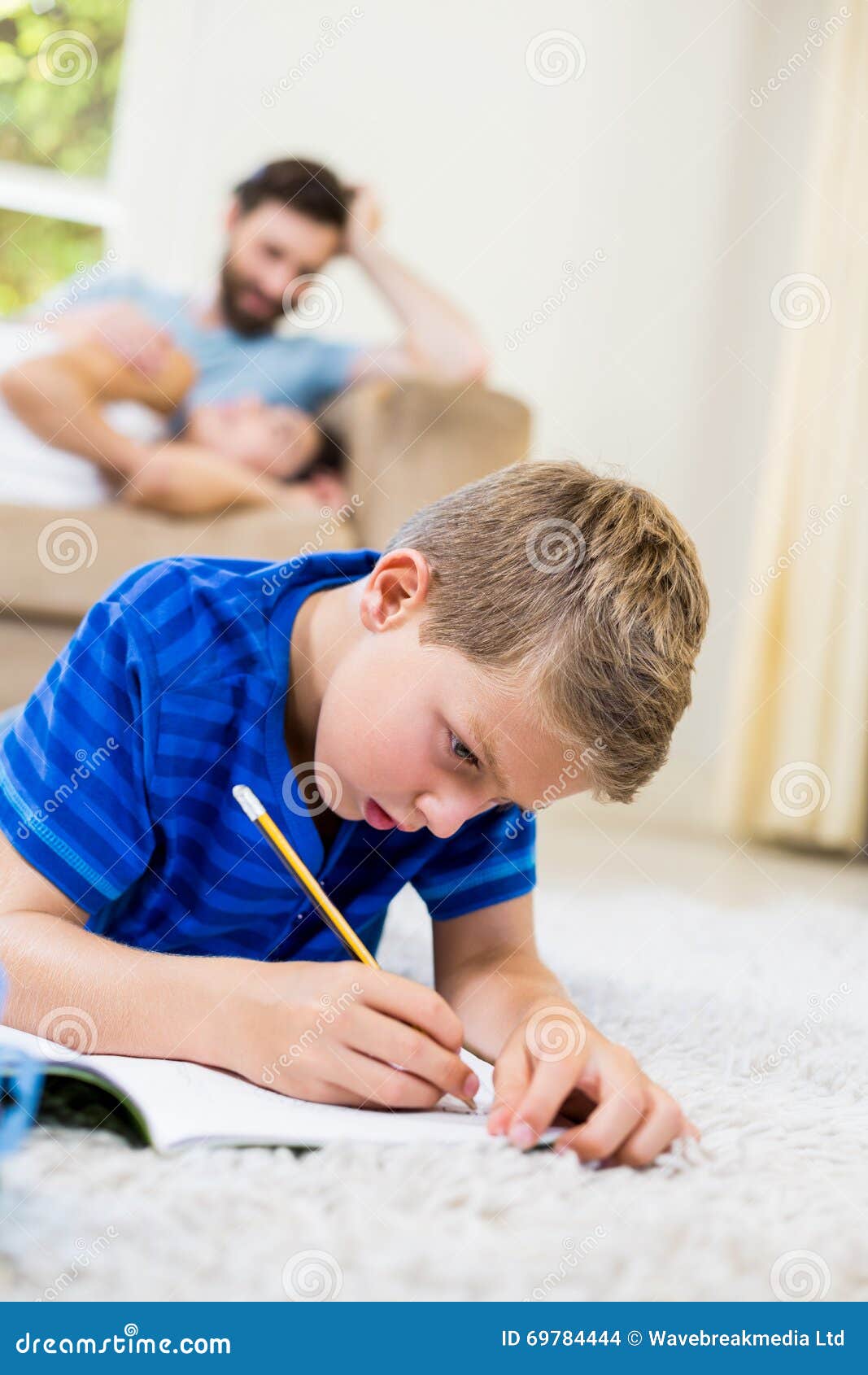 Boy Doing Homework in Living Room Stock Photo - Image of closeness ...