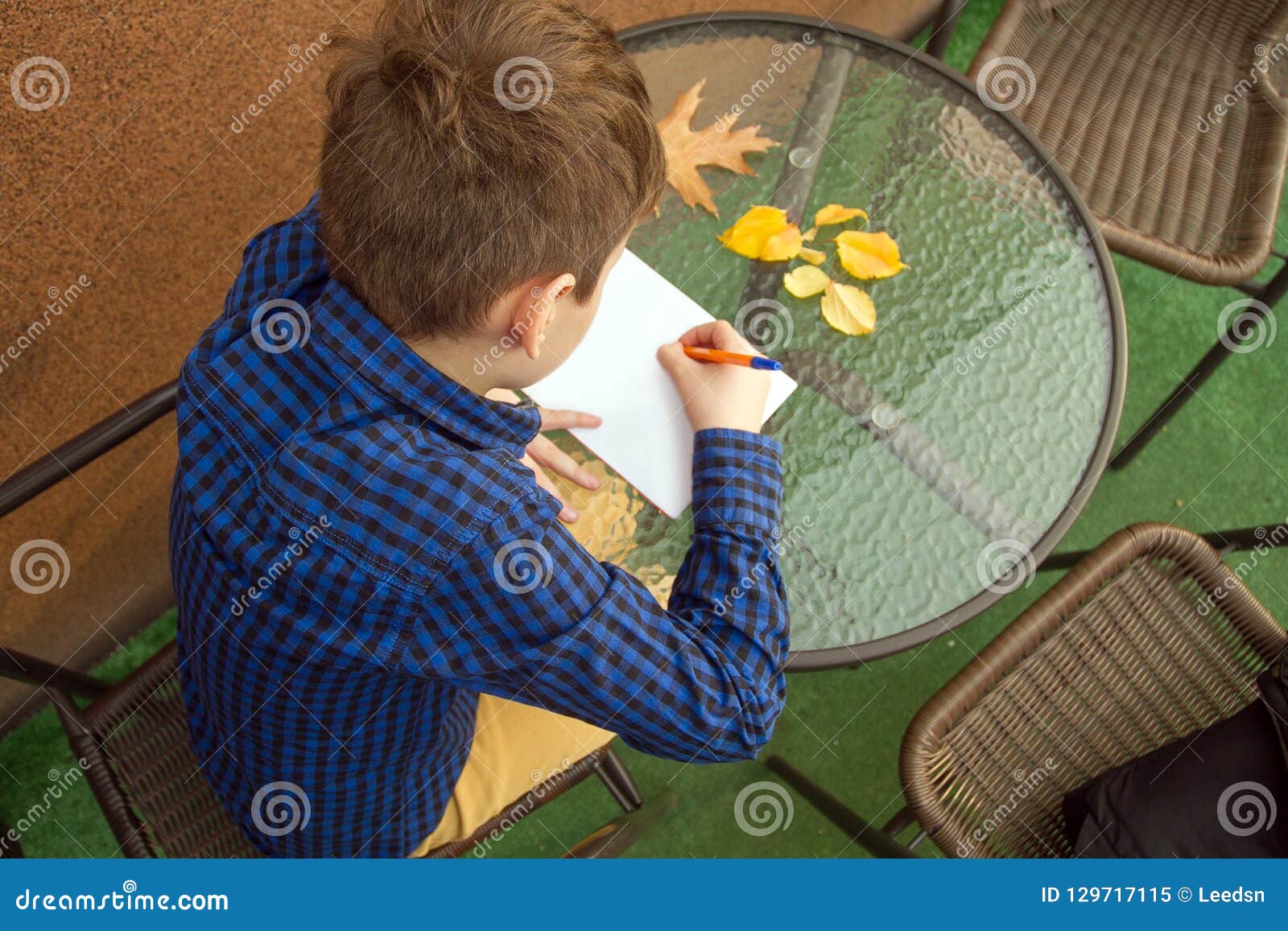 Boy is Doing Homework Outdoors Stock Image - Image of paper, educate ...