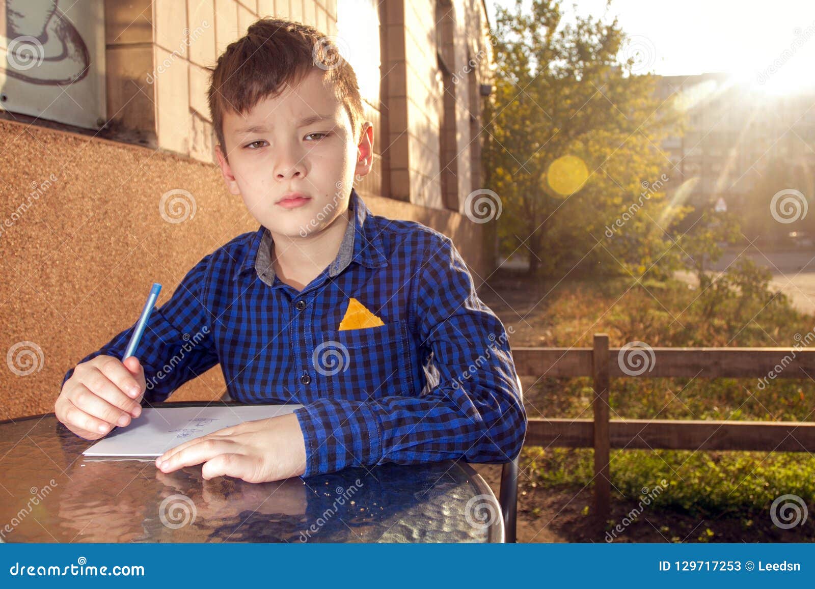 Boy is Doing Homework Outdoors Stock Image - Image of concentrate ...