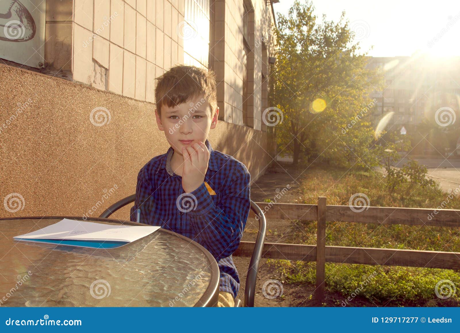 Boy is Doing Homework Outdoors Stock Image - Image of childhood, essay ...