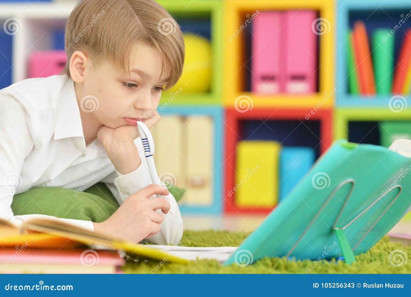 Boy doing homework stock image. Image of book, looking - 105256343