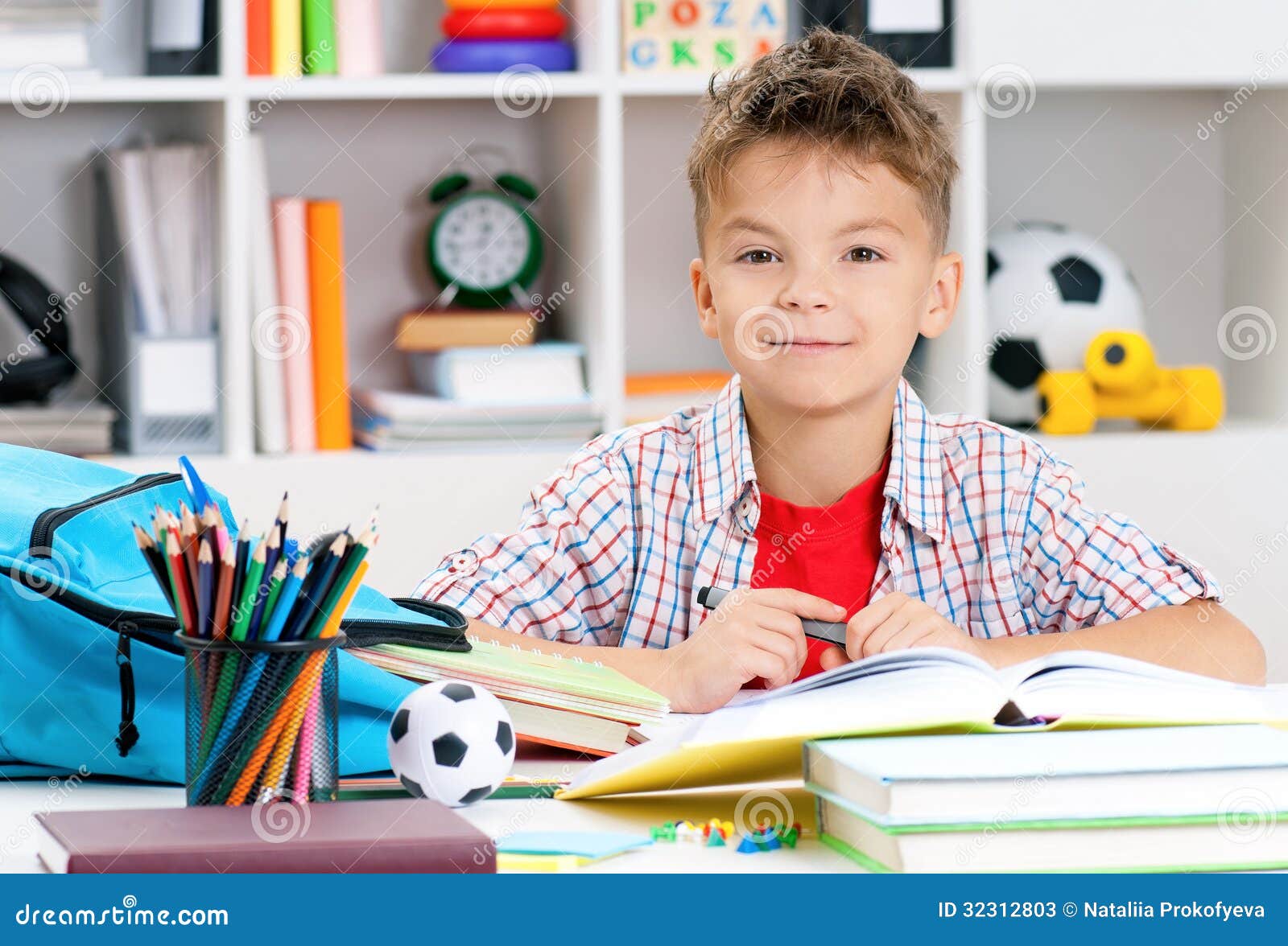 Boy doing homework stock image. Image of classroom, desk - 32312803