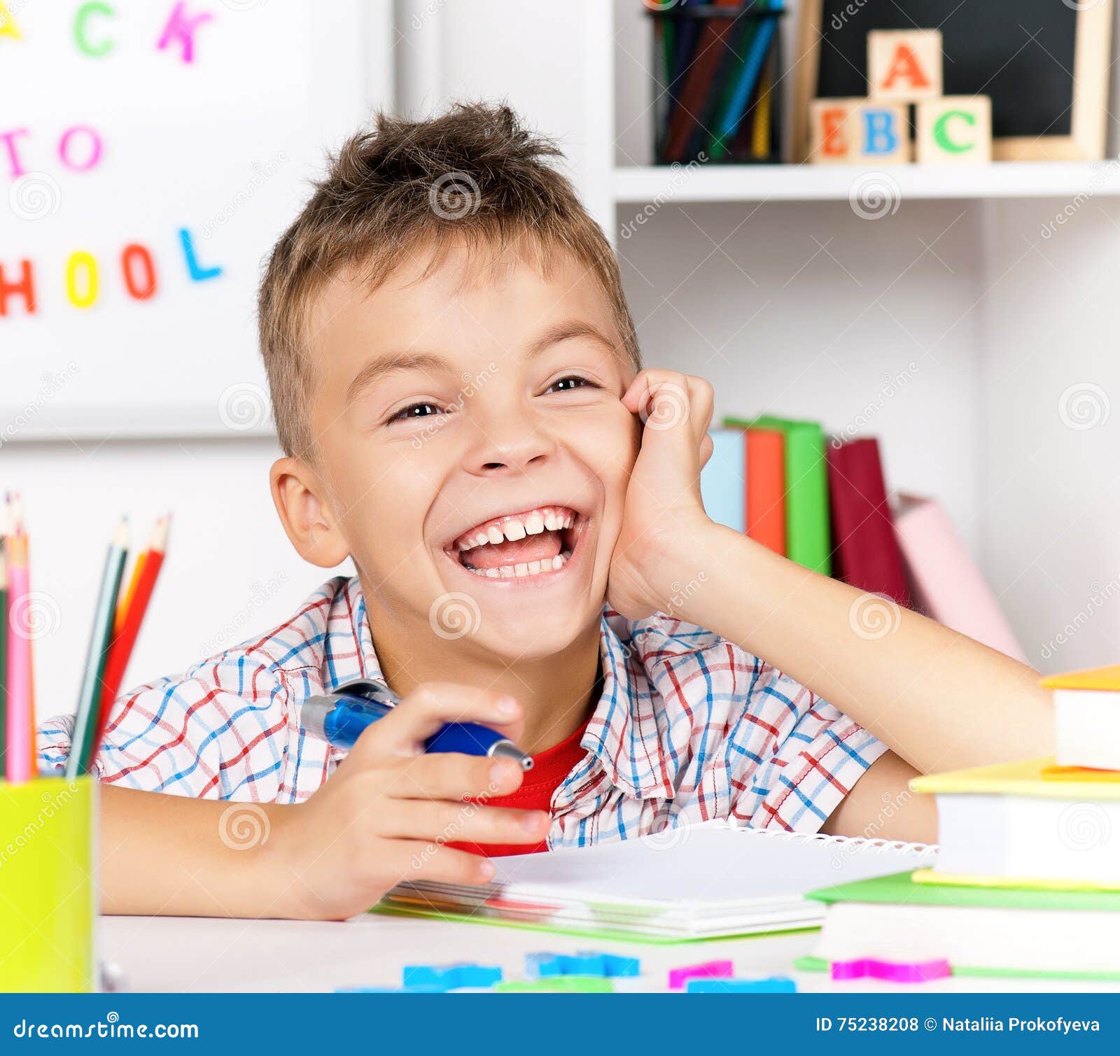 Boy doing homework stock photo. Image of people, classroom - 75238208
