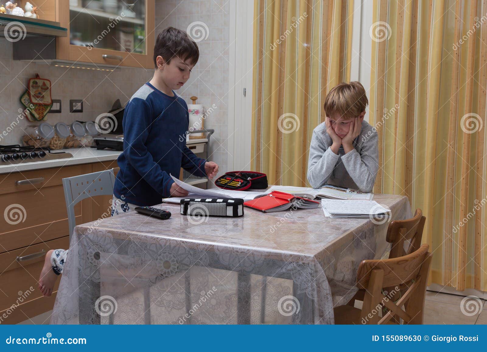 Boy Doing Homework: Studying in the Kitchen at Home Stock Photo - Image ...