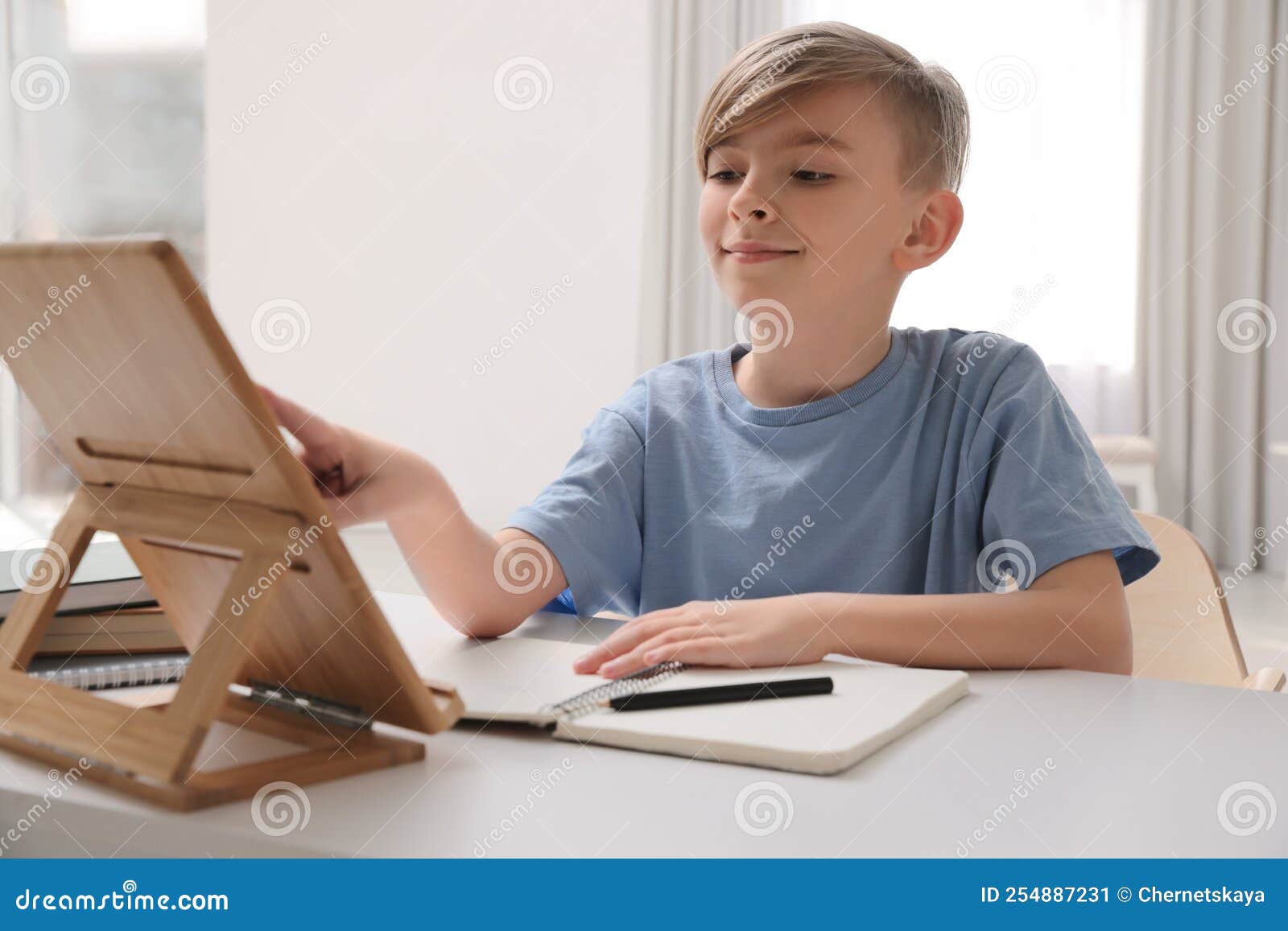 Boy Doing Homework with Tablet at Table Stock Image - Image of happy ...