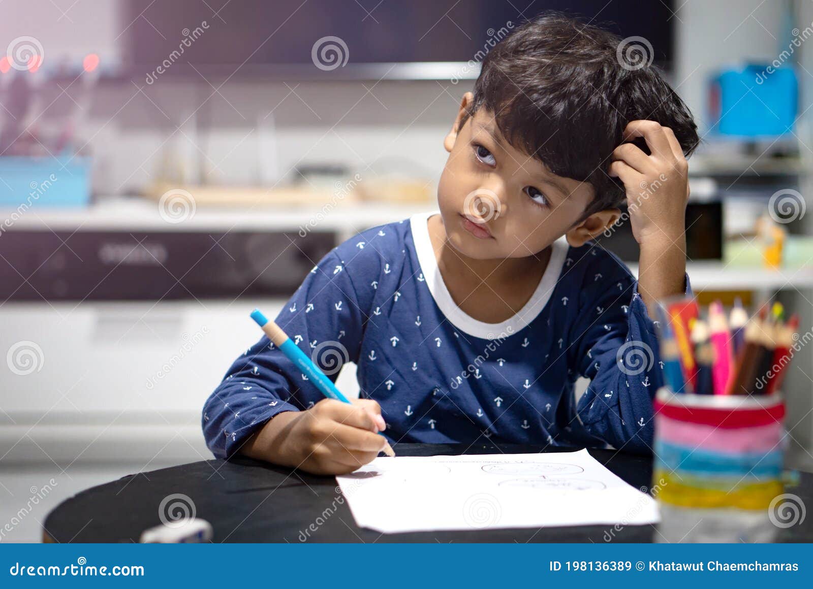 Boy Doing Homework or Work Sheet before Bedtime Stock Image - Image of ...