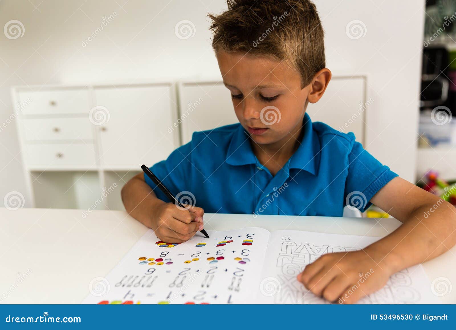 Boy doing homework stock photo. Image of calculation - 53496530