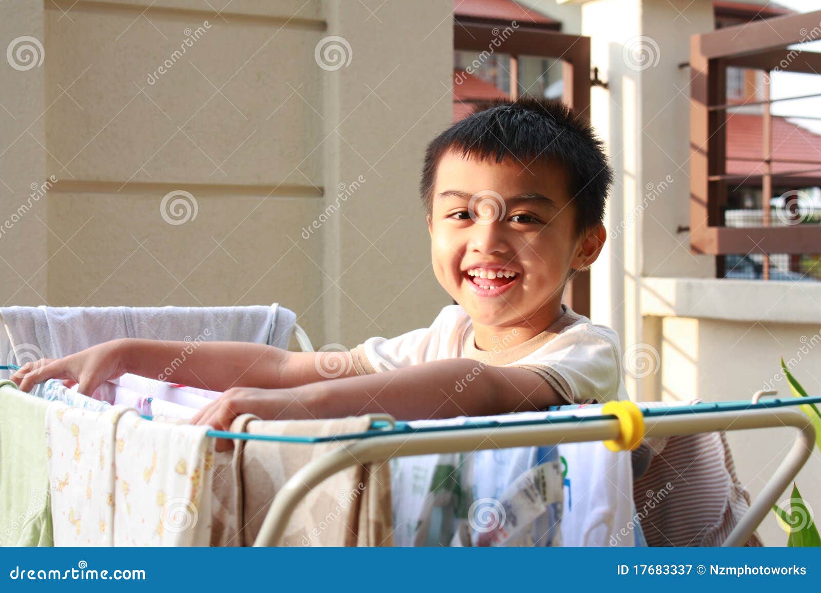 Boy Doing Laundry stock image. Image of grow, chore, smile - 17683337